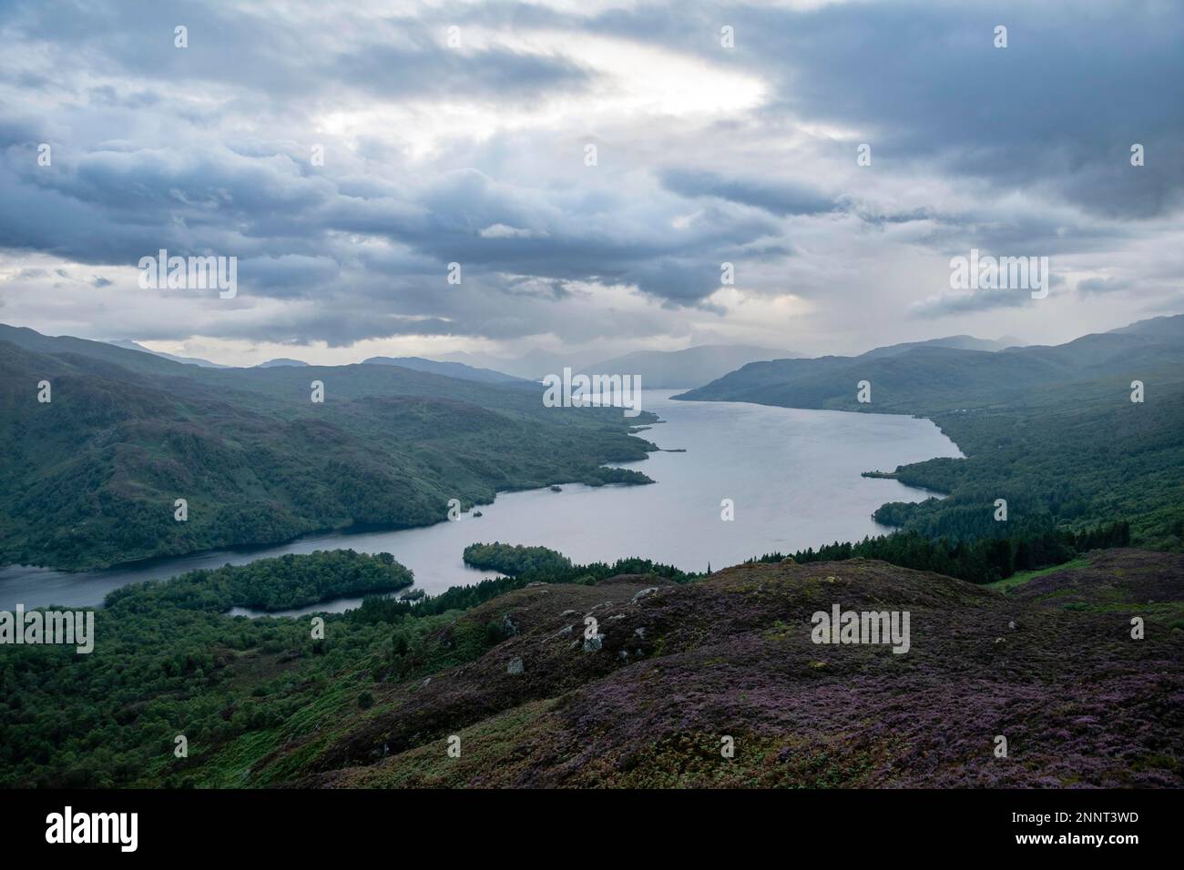 View over Loch Katrine from Ben Aan under cloudy skies, The Trossachs ...