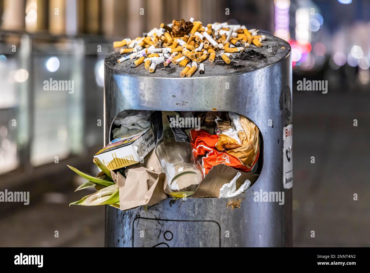 Full waste bins with packaging waste and cigarette butts, Stuttgart ...