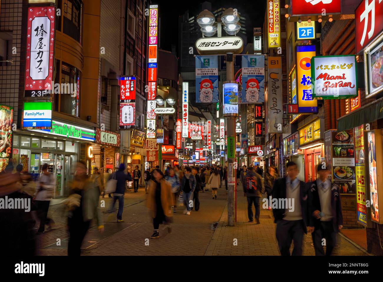 Street scene in the Shibuya district at night, Tokyo, Japan Stock Photo ...