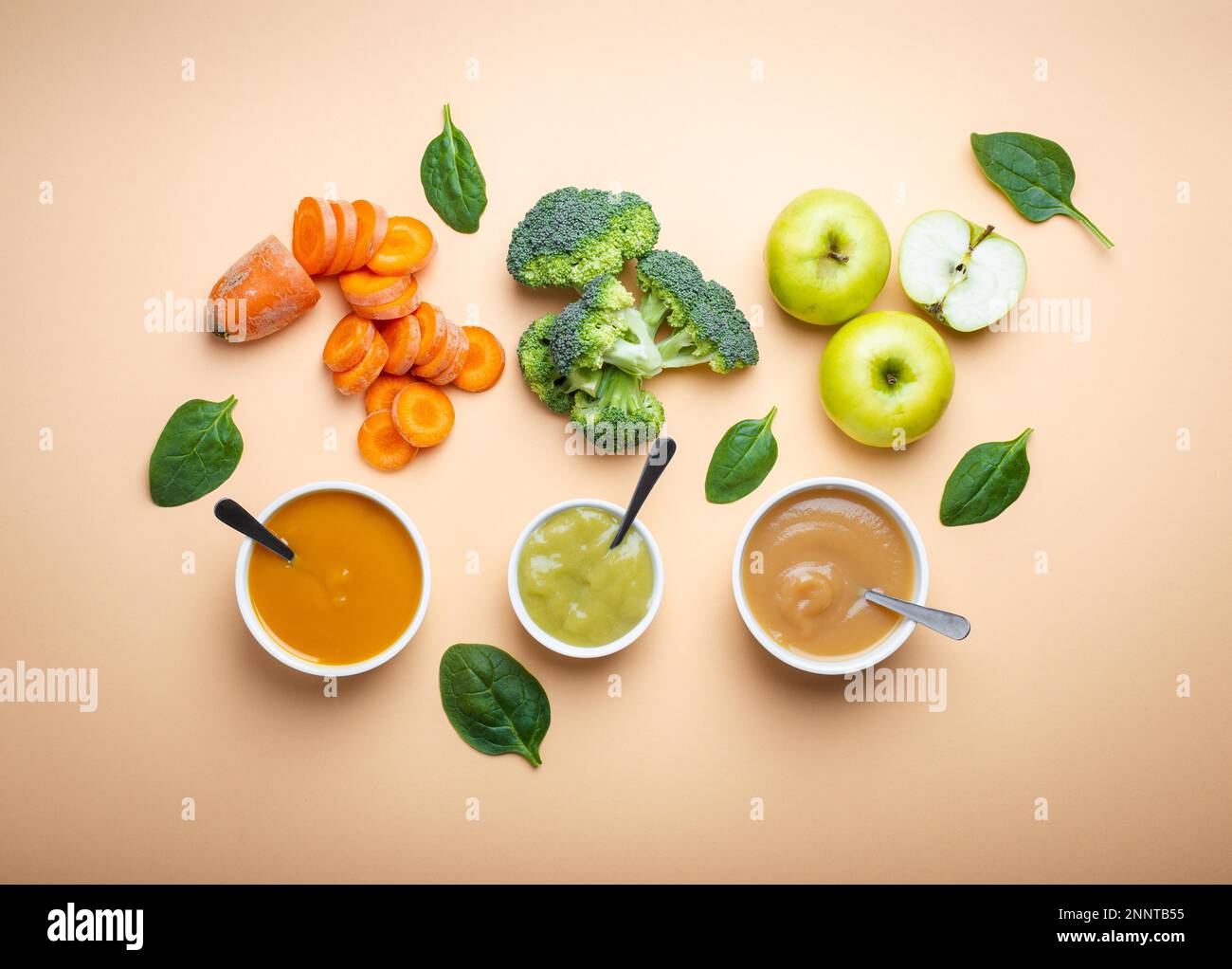 White bowls with healthy natural baby food on pastel background. Purees ...
