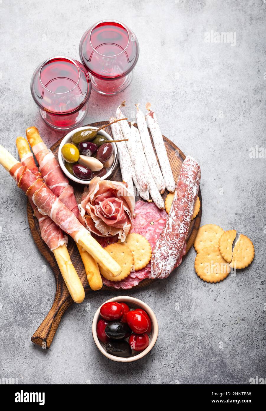 Variety of cold meat cuts and appetizers, red wine, prosciutto, jamon ...