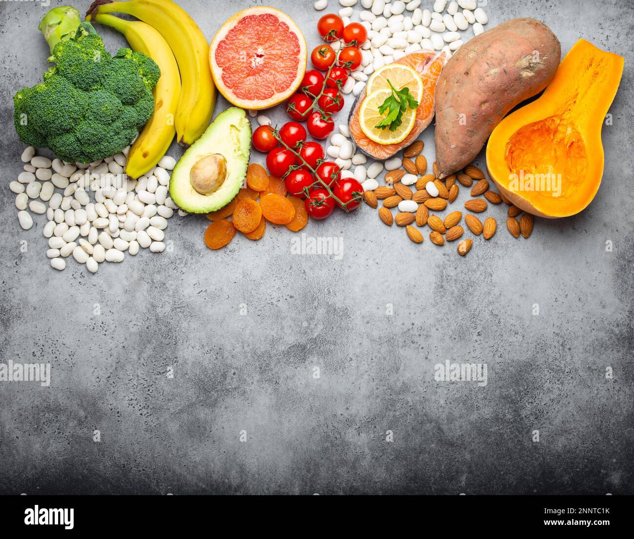 Vegetables, fruit and foods containing potassium, stone background, top ...