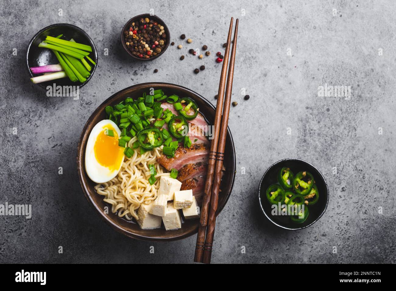 Delicious Asian noodle soup ramen in bowl with meat broth, tofu, sliced ...
