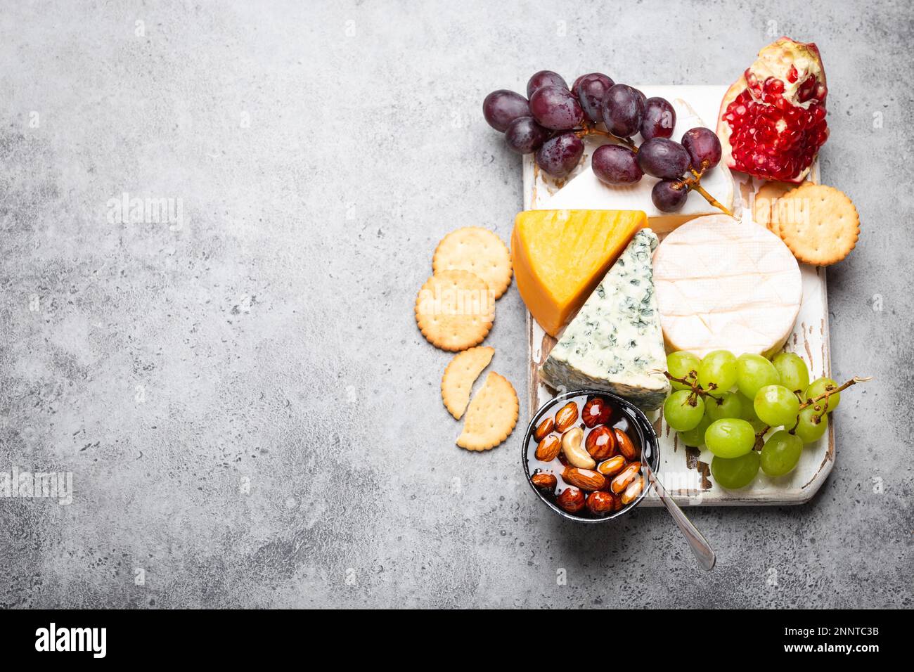 Selection of cheese and appetizers, camembert, brie, cheddar, bread ...