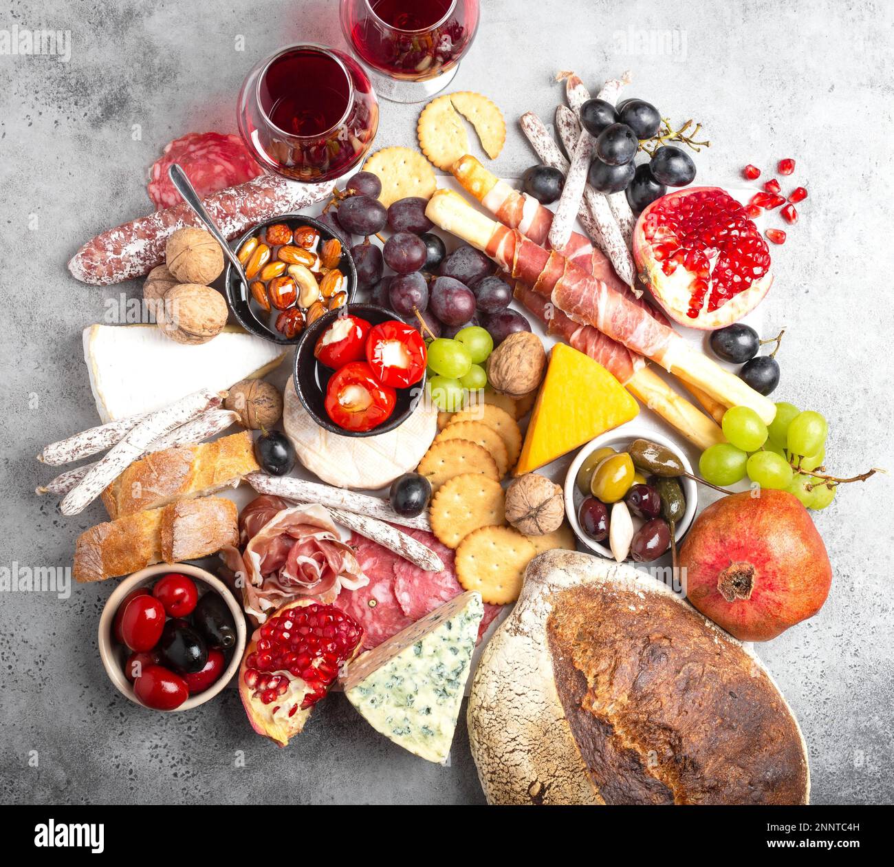 Festive gourmet mix of snacks and appetizers, cheese, meat, olives ...