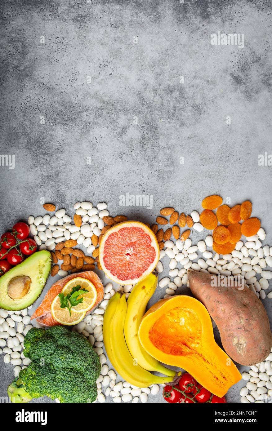 Vegetables, fruit and foods containing potassium, stone background, top ...