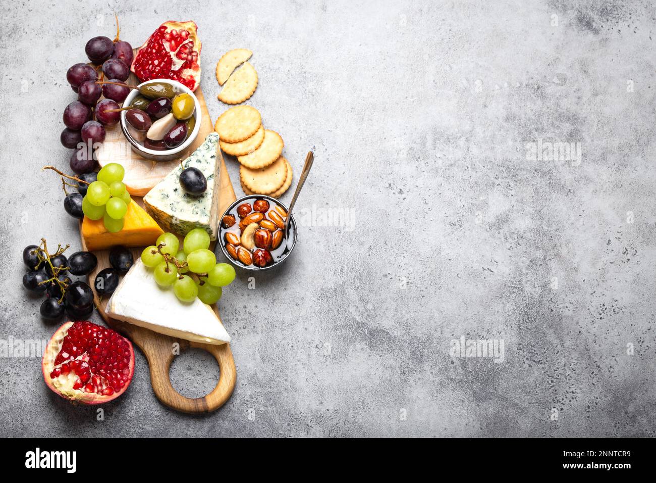 Selection of cheese and appetizers, camembert, brie, cheddar, bread ...