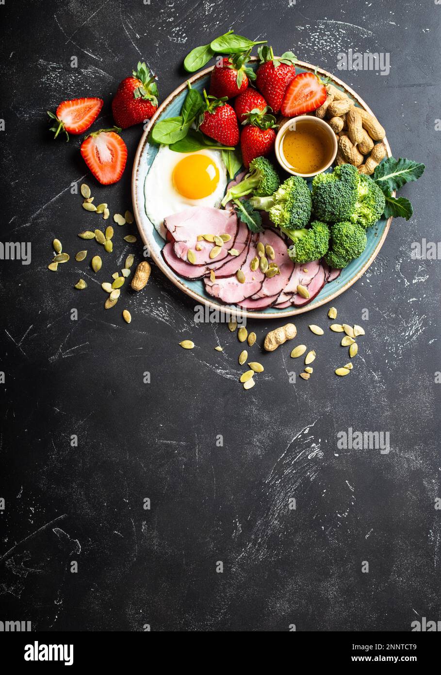 Ketogenic low carbs diet, top view, space for text. Plate on stone ...