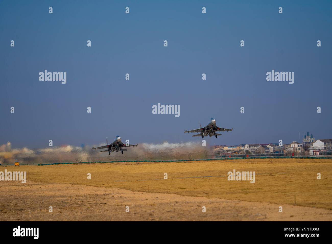 Two J-16 air fighters take off at a training base of PLA's naval ...