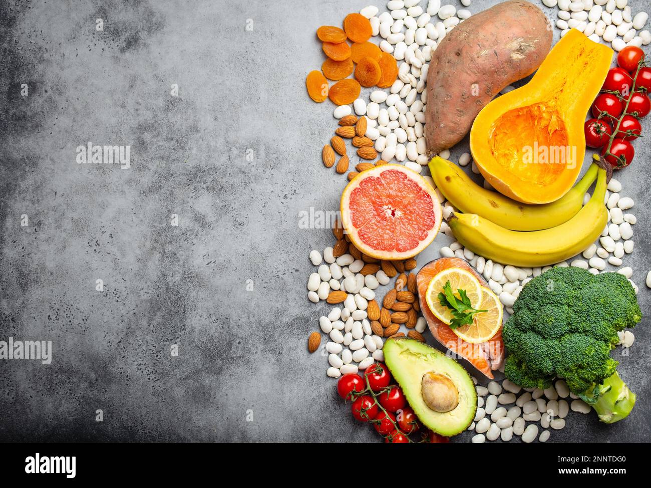 Vegetables, fruit and foods containing potassium, stone background, top ...