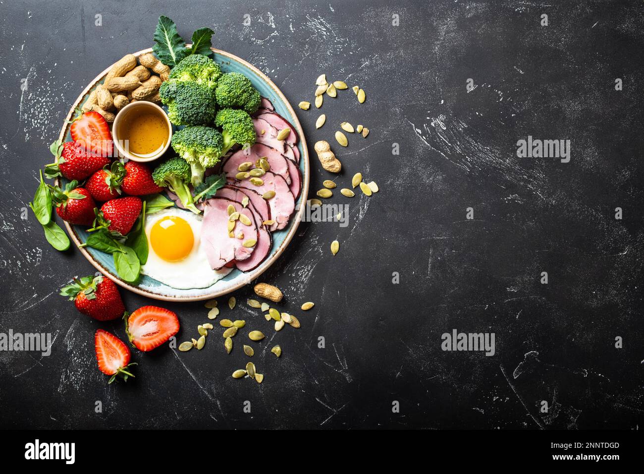 Ketogenic low carbs diet, top view, space for text. Plate on stone ...