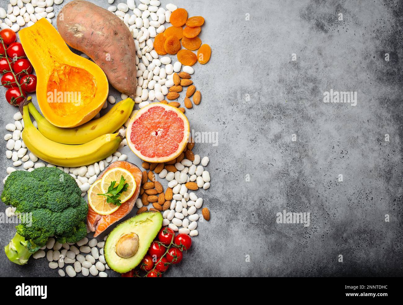 Vegetables, fruit and foods containing potassium, stone background, top ...