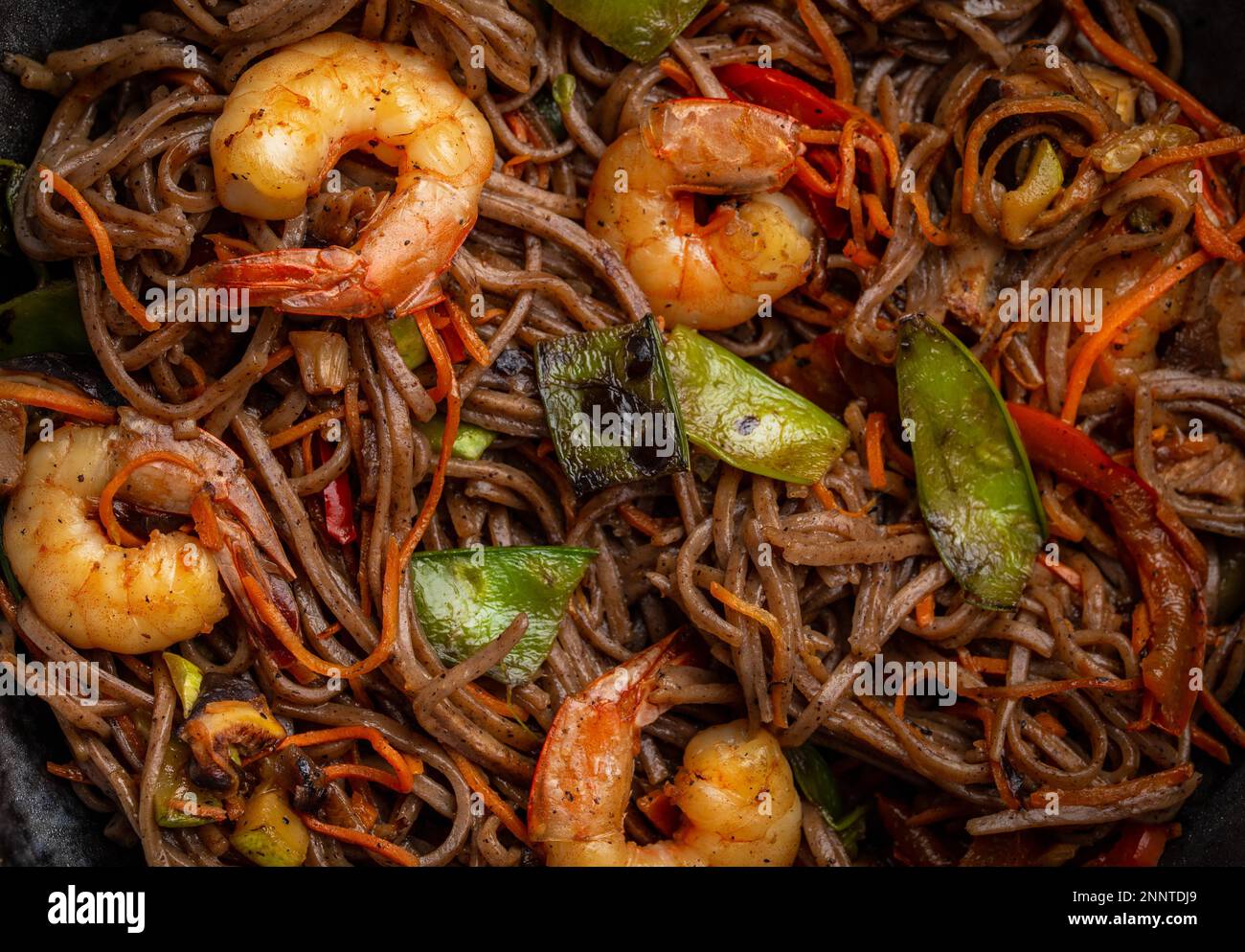 Close-up of Chinese soba stir-fry noodles with shrimps and vegetables ...