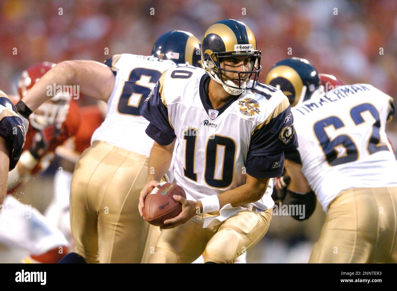 23 AUGUST 2004: Rams quarterback Marc Bulger (10) hands off the ball in ...