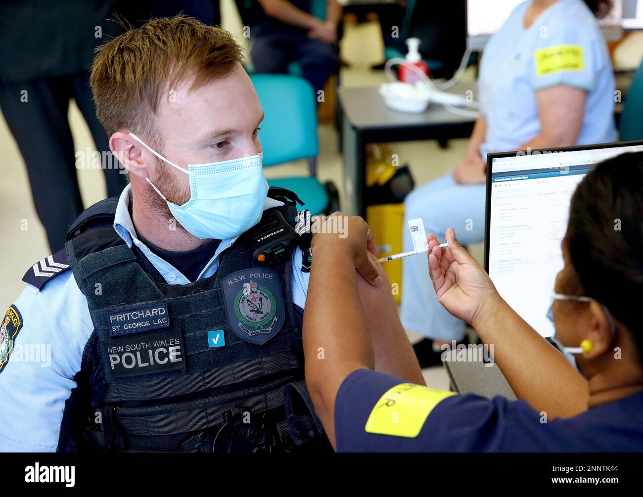 New South Wales Police officer Lachlan Pritchard receives the Pfizer ...