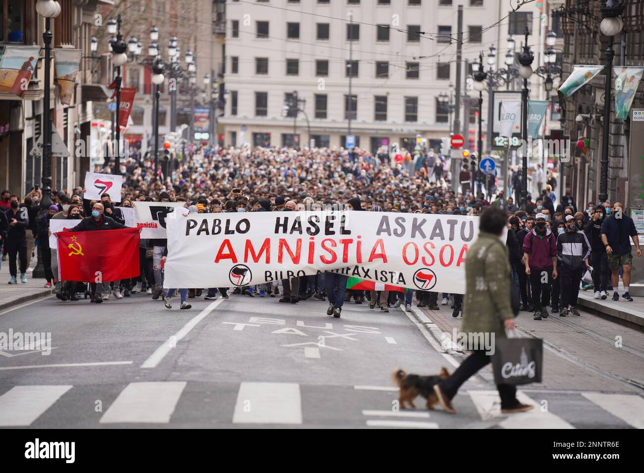 Hundreds of people with a banner during a demonstration against the ...