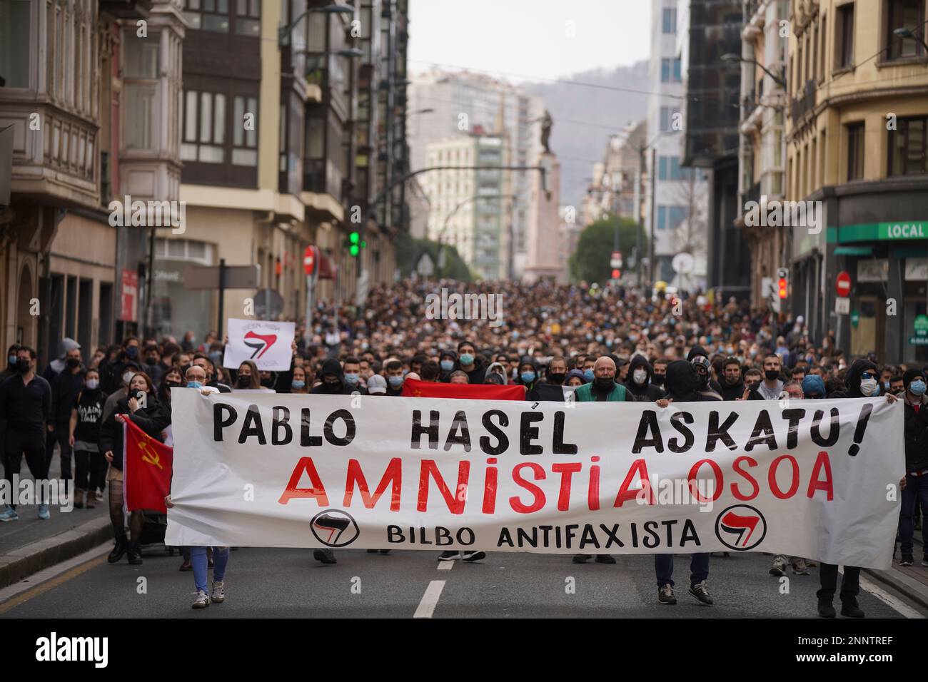 Hundreds of people with a banner during a demonstration against the ...