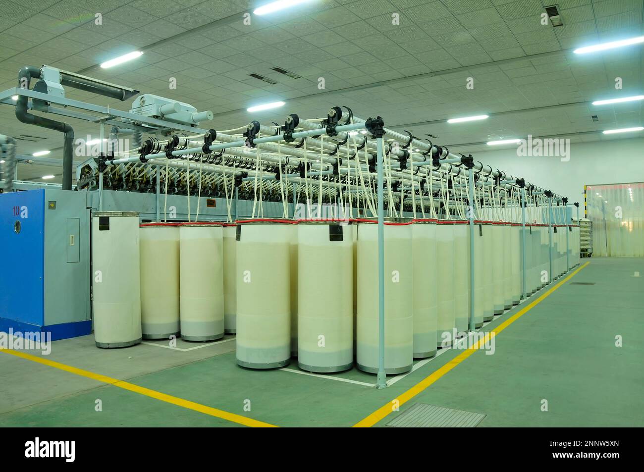 Cotton group in spinning production line factory Stock Photo - Alamy