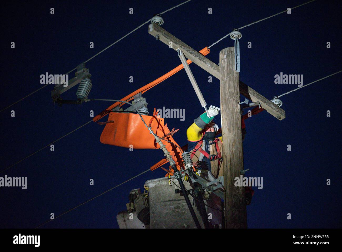 Oncor apprentice lineman Brendan Waldon repairs a utility pole that was ...