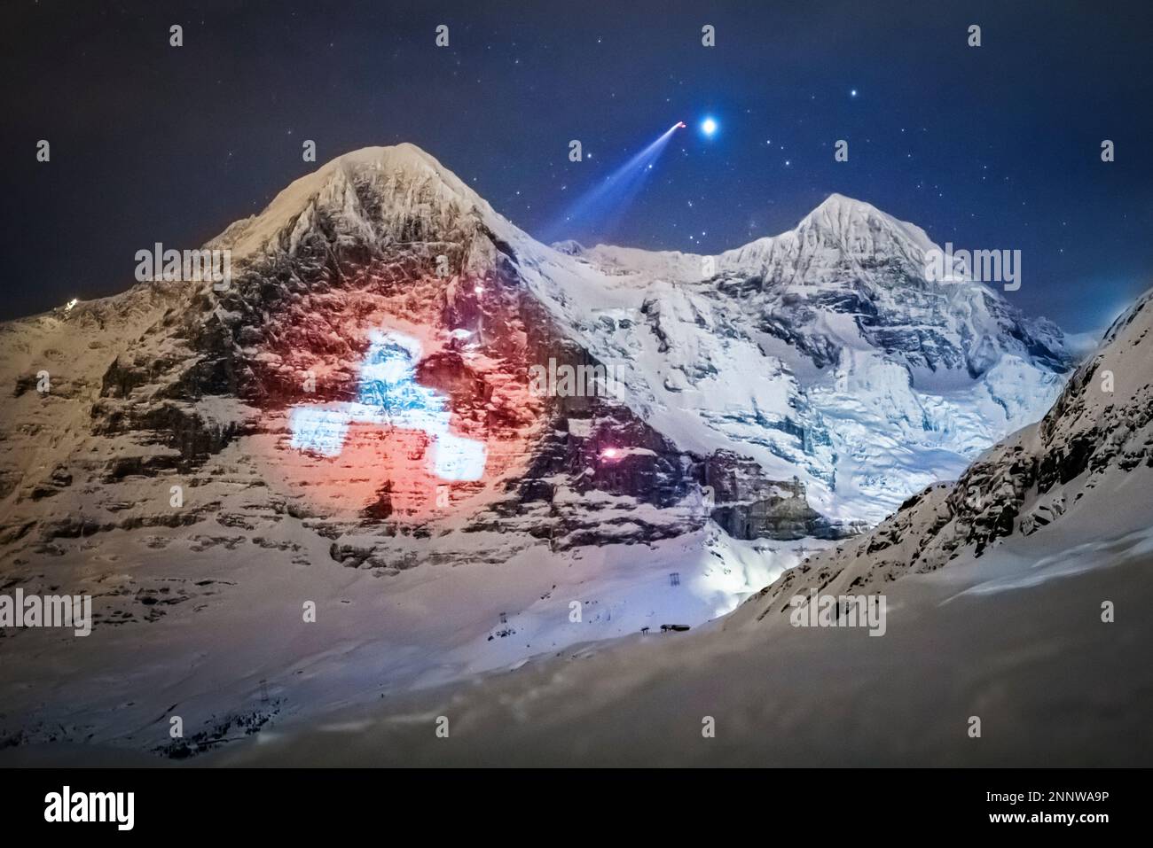 A giant projection of the NASA Mars 2020 mission logo on the north face of the Eiger mountain ...