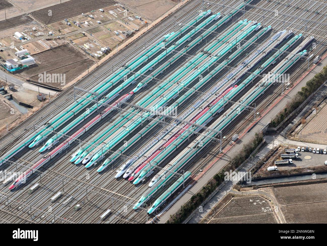 An aerial shows Shinkansen bullet trains lined at the JR East ...