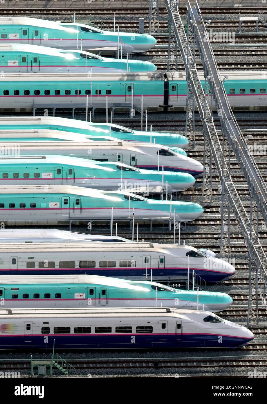 An aerial shows Shinkansen bullet trains lined at the JR East ...