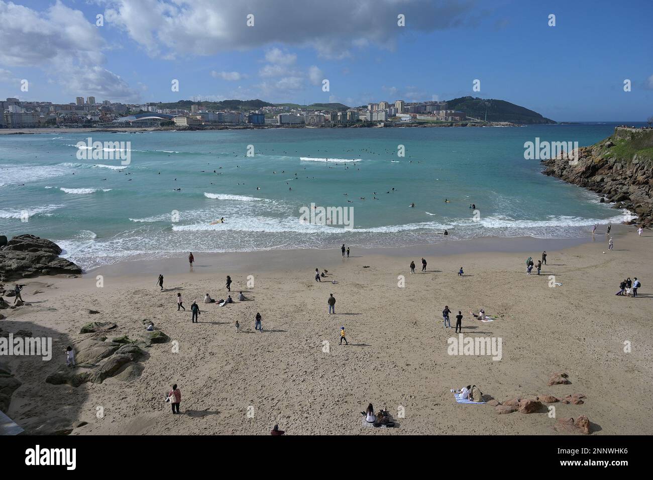 A Several people enjoy an early spring day with temperatures of 20ºC ...