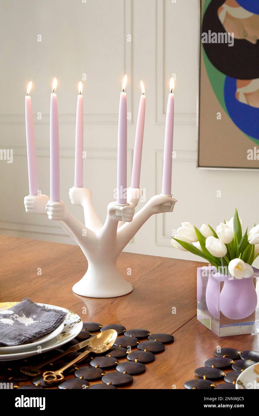 This image provided by Jonathan Adler shows a candlestick holder ...