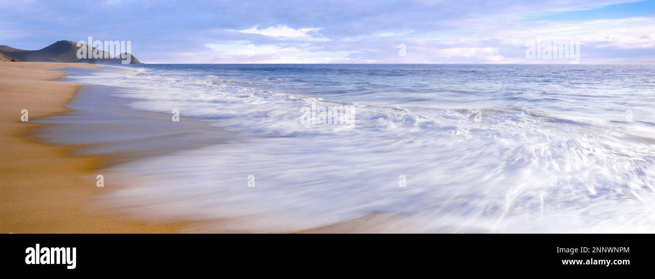 Long exposure shot of surf on beach, Playa la Cachora, Baja California ...