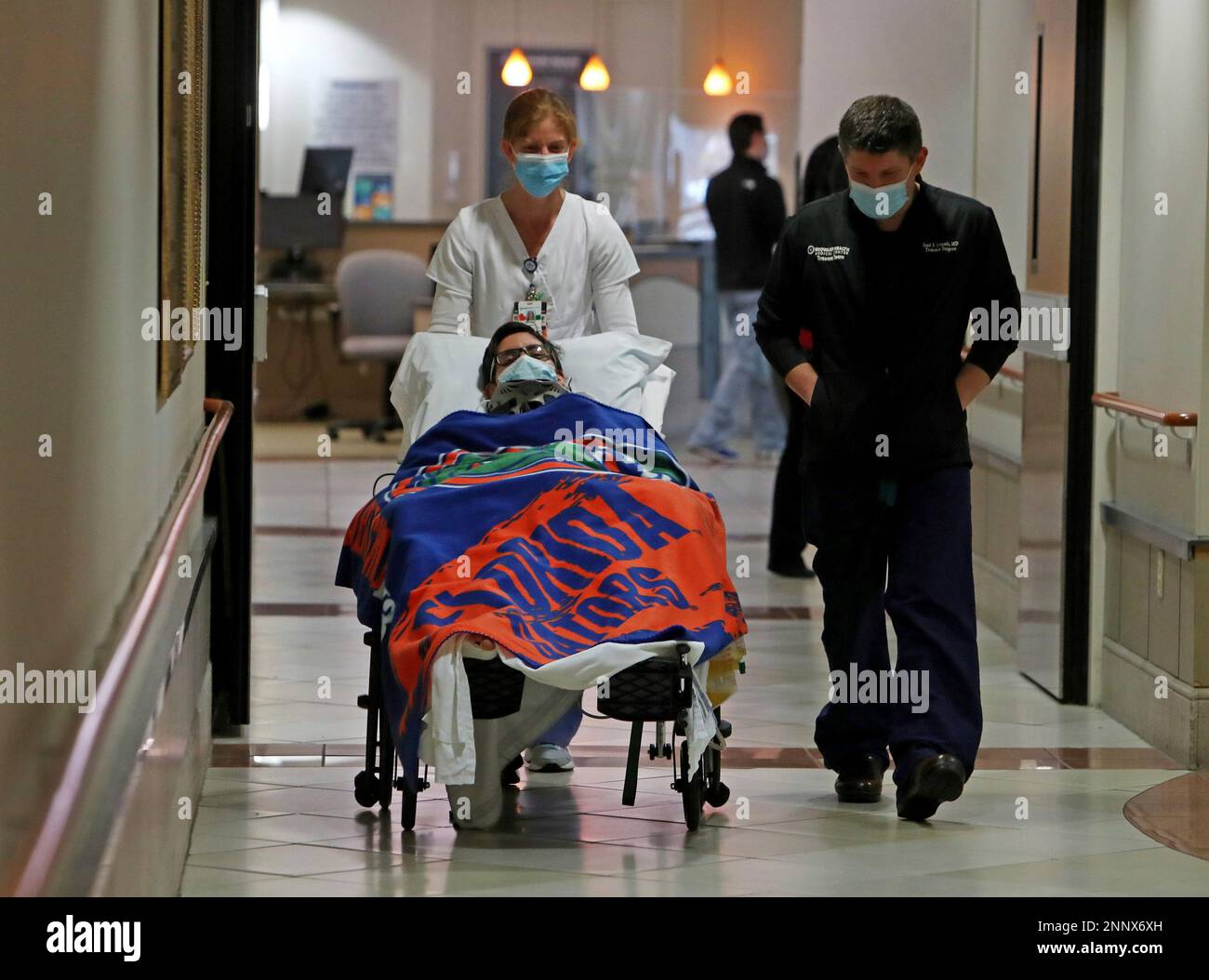 Broward Health nurse Brooke Freeman and Dr. Jose Lozada escort Jose ...