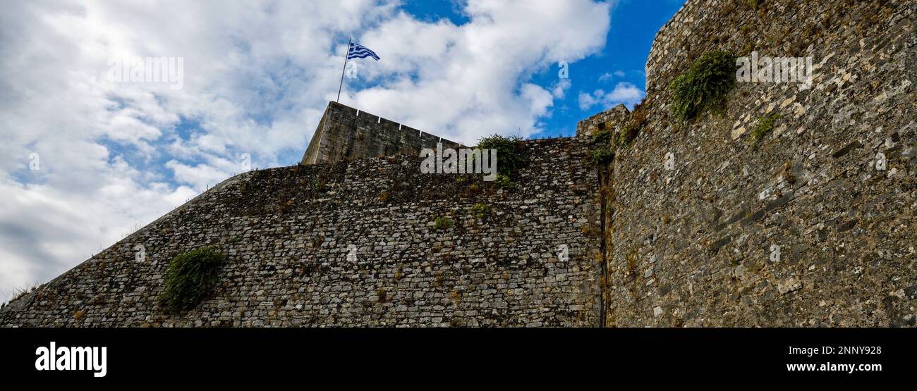 Wall of old fort and Greek flag, old town, Corfu, Ionian Islands ...