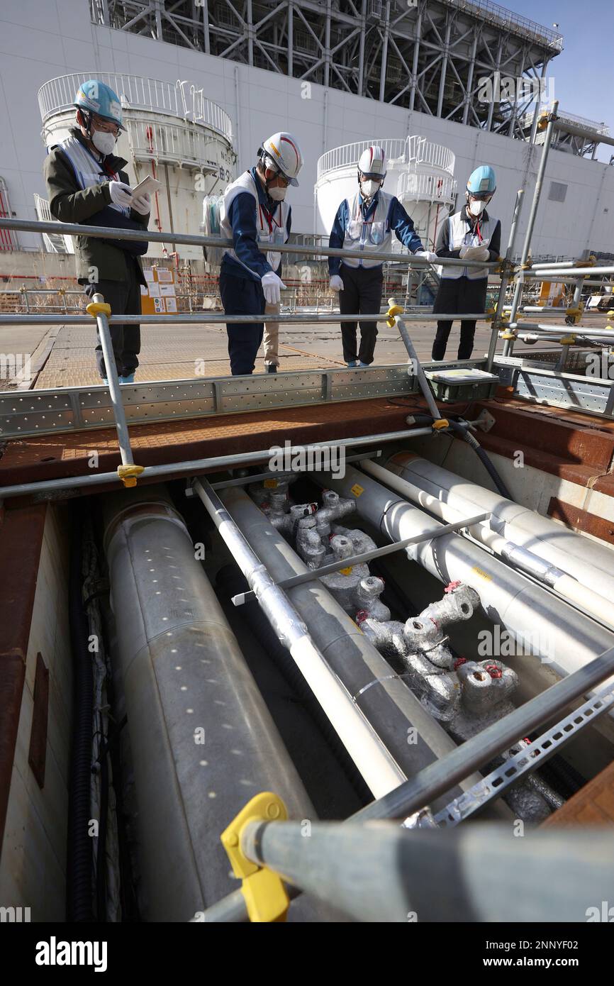 A photo shows an ice wall, a barrier of frozen soil encircling the ...