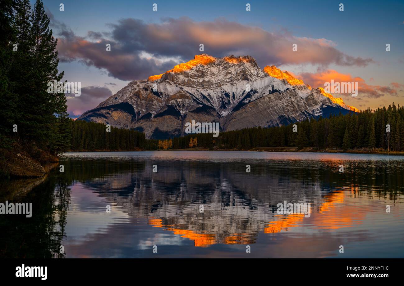 Cascade Mountain reflected in Johnson Lake, Alberta, Canada Stock Photo ...