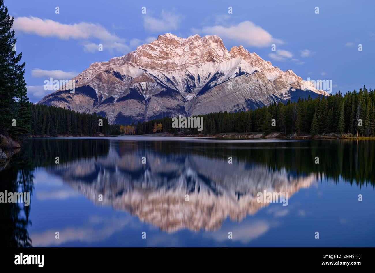 Cascade Mountain reflected in Johnson Lake, Alberta, Canada Stock Photo ...