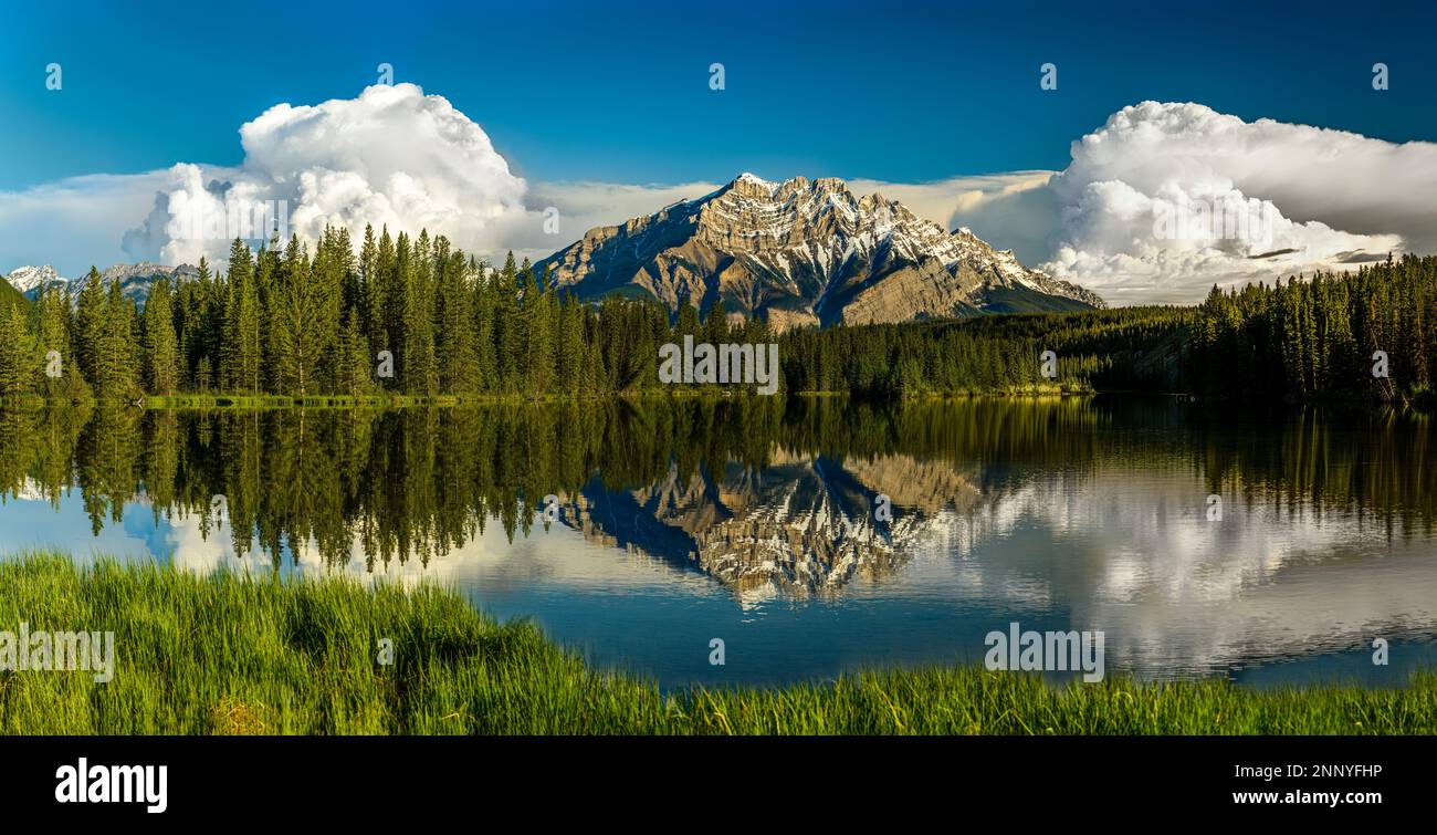 Cascade Mountain reflected in Carrot Creek Pond, Alberta, Canada Stock ...
