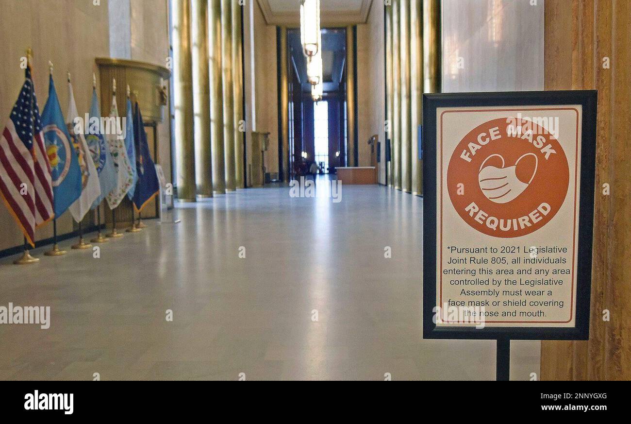 Signs in the North Dakota Capitol remind visitors to wear a face mask ...