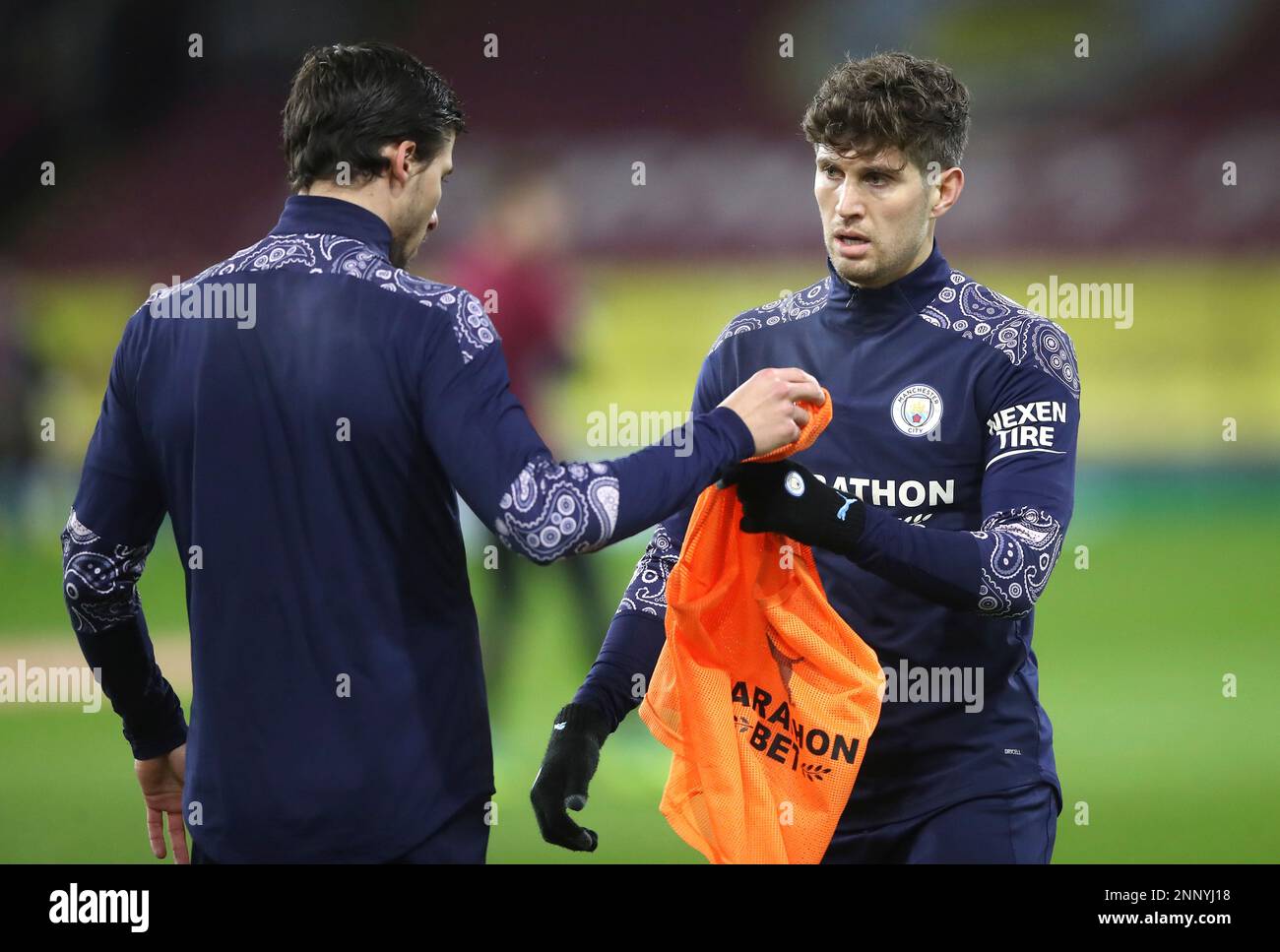 Manchester City's John Stones, right, and Ruben Dias before the English ...