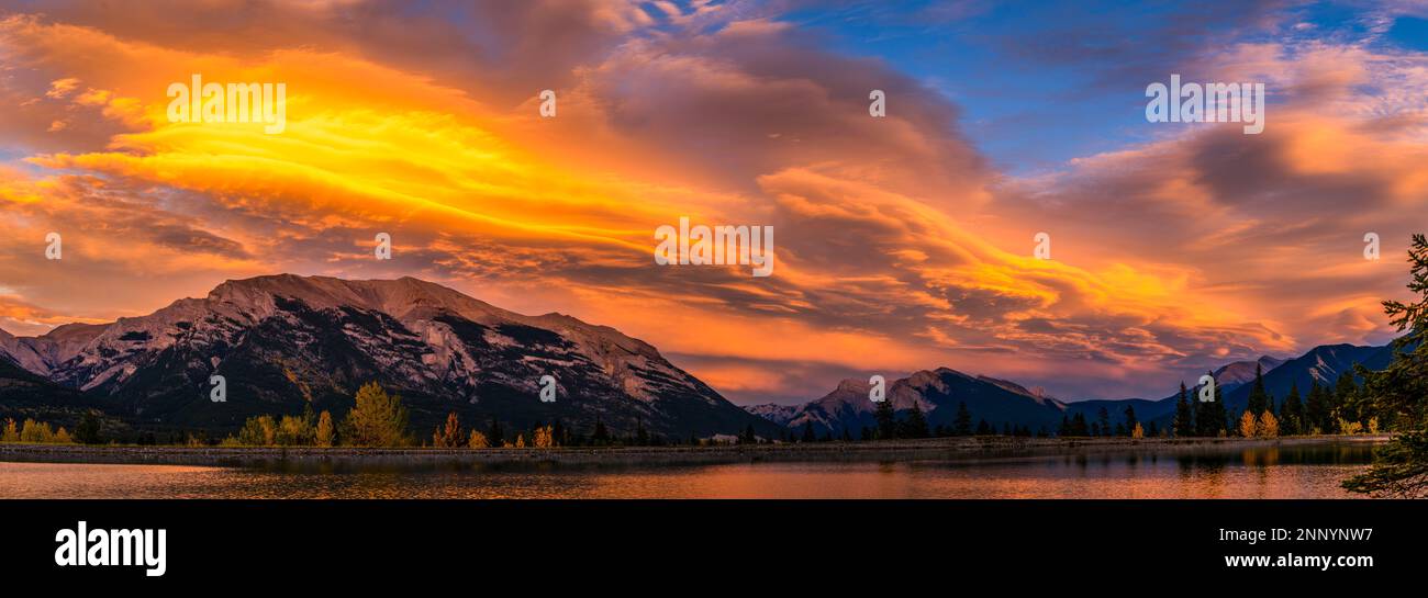 Grotto Mountain reflected in Rundle Forebay reservoir at sunset ...