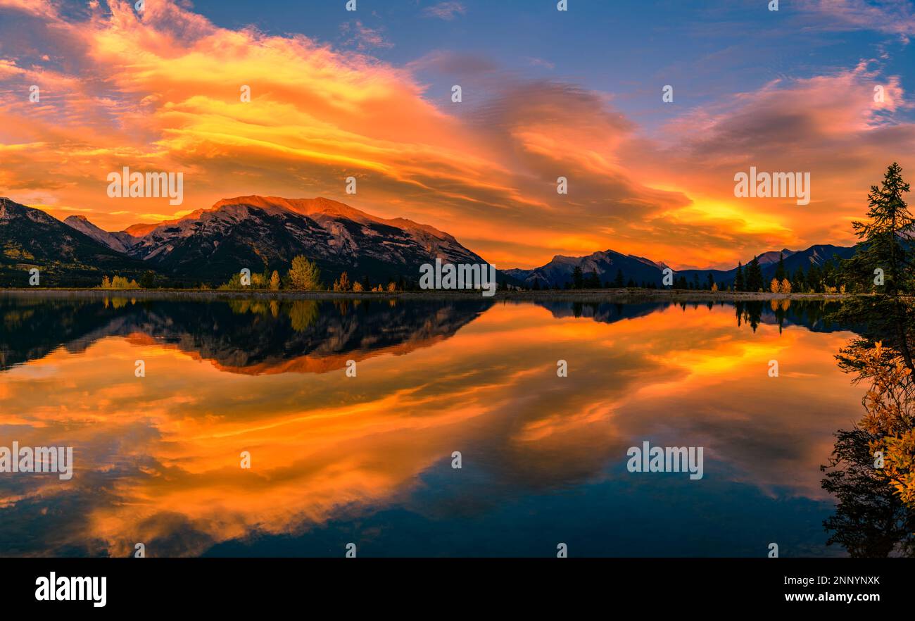 Grotto Mountain reflected in Rundle Forebay reservoir at sunset ...