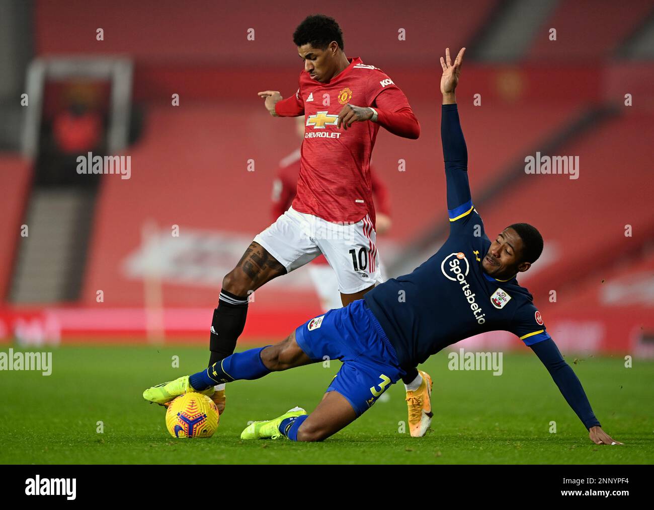 Manchester United's Marcus Rashford, left, duels for the ball with ...