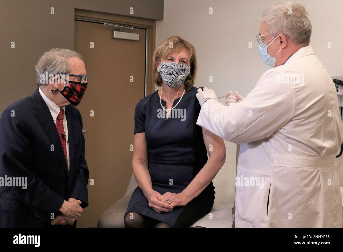 Ohio Governor Mike DeWine, left, looks on as first lady Fran DeWine ...