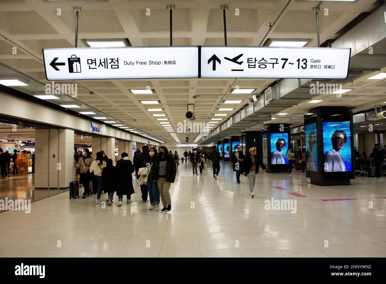Korean people and foreign traveler passengers walking carry luggage bag ...