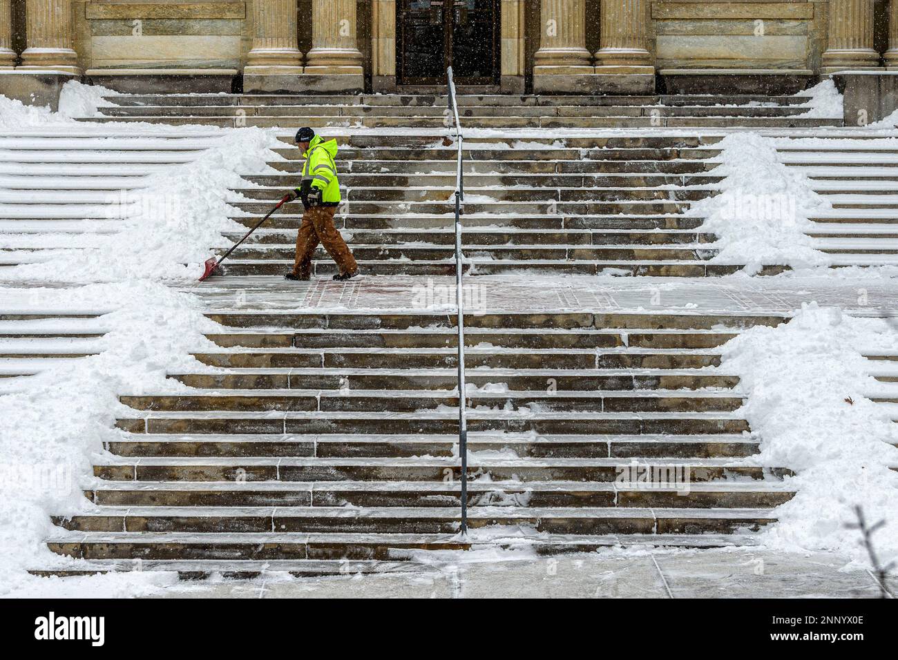 Town worker Kevin Teets shovels snow from the steps of the George ...