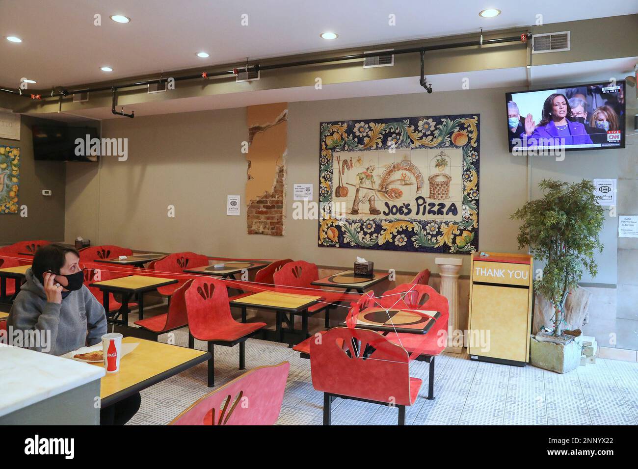 Patrons inside Joe's Pizza watch as Kamala Harris makes history while ...