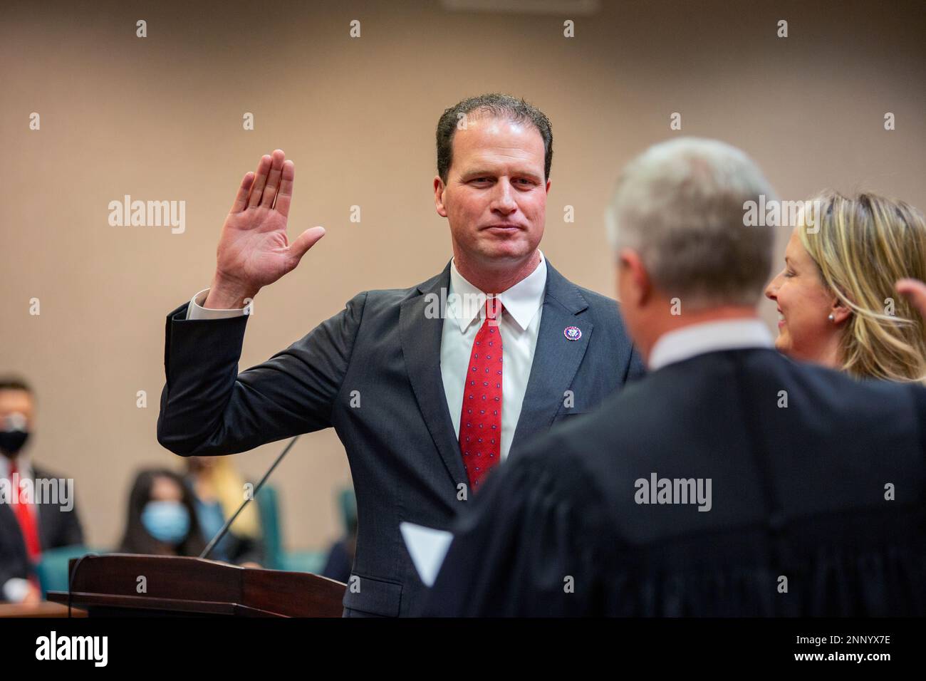 Congressman August Pfluger looks at Judge Walter Counts as he recites ...