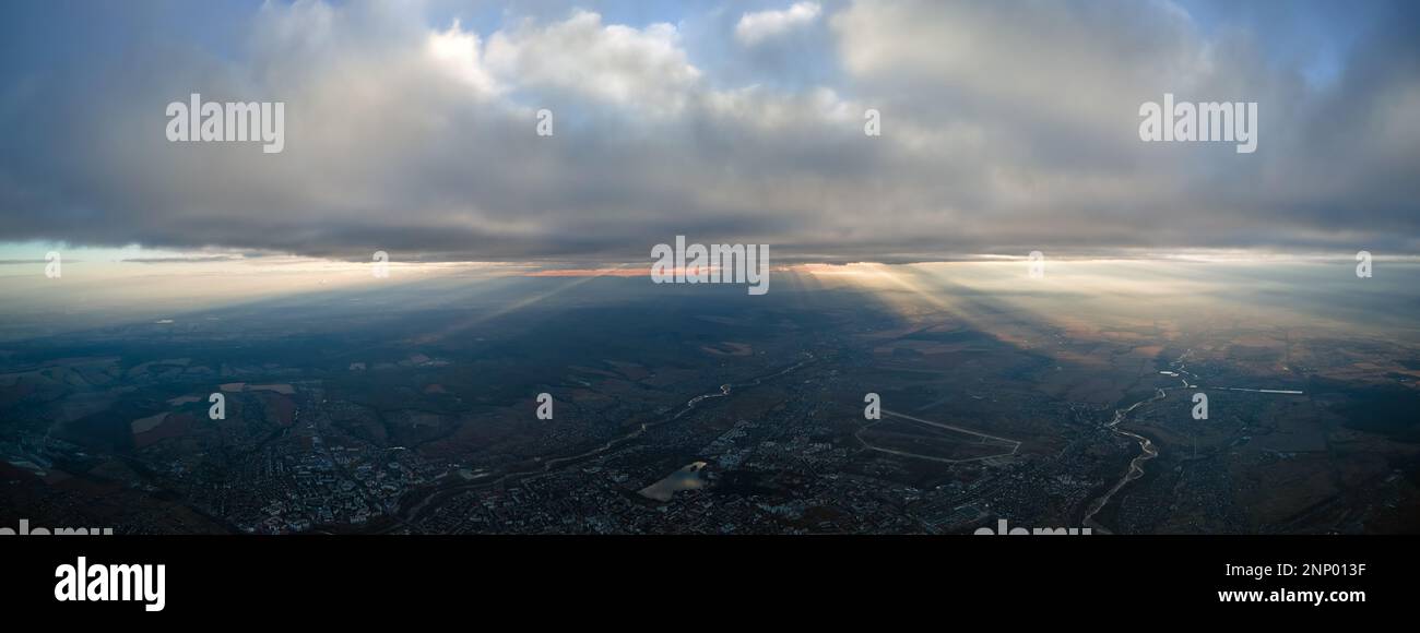 Aerial view from airplane window at high altitude of distant city ...