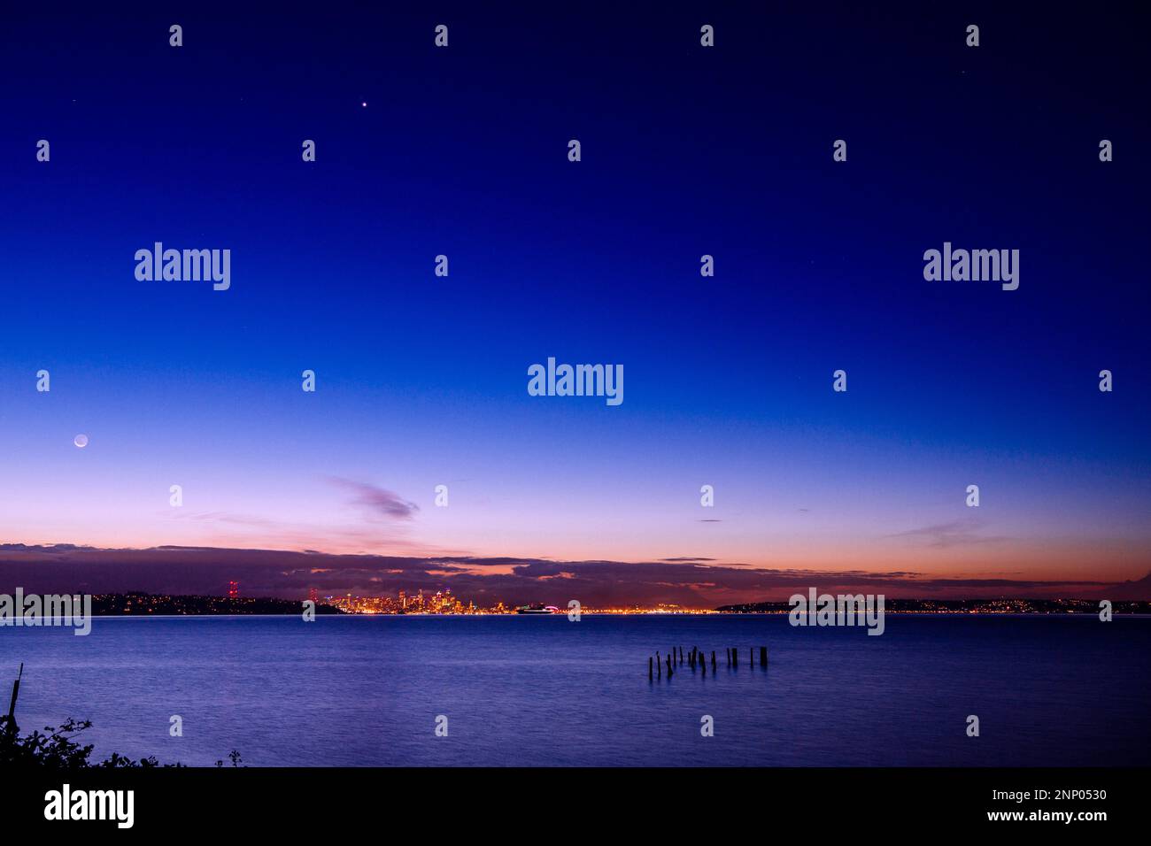 Clear sky over distant skyline of Seattle at night, Washington State ...