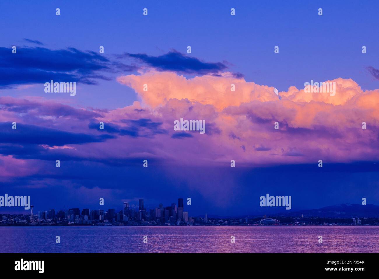 Pink clouds and full moon at sunset Stock Photo - Alamy