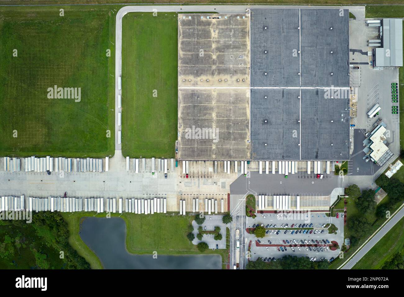 Aerial view of large commercial loading bay with many delivery trucks ...