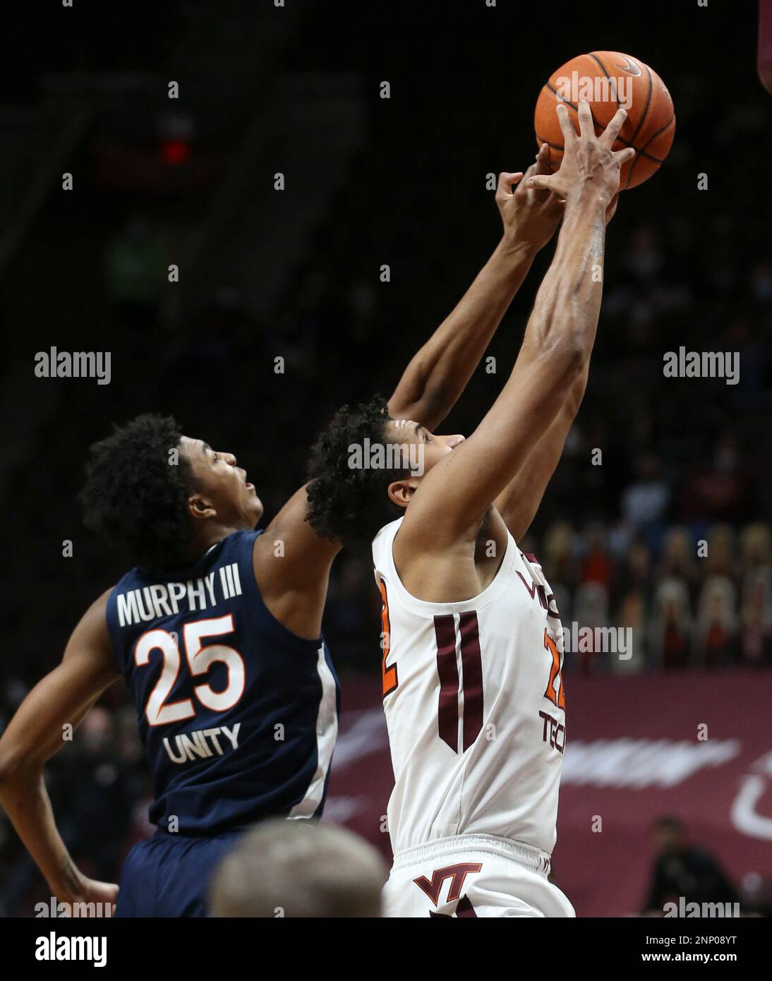 Virginia Tech's Keve Aluma (22) right, competes for a rebound with ...